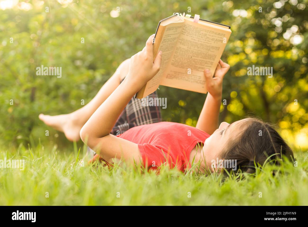Little Girl Reading Outside