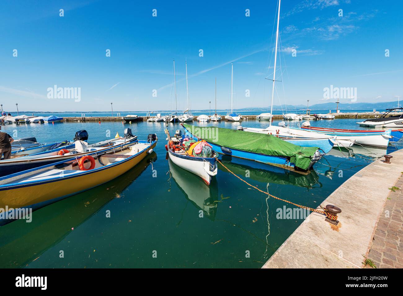 Small port on the coast of Lake Garda (Lago di Garda). Village of ...
