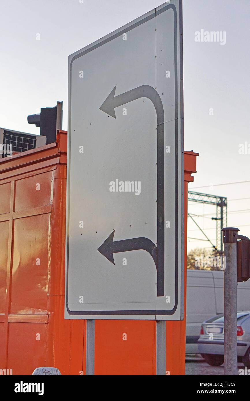 Directional arrows at white information board traffic sign Stock Photo ...