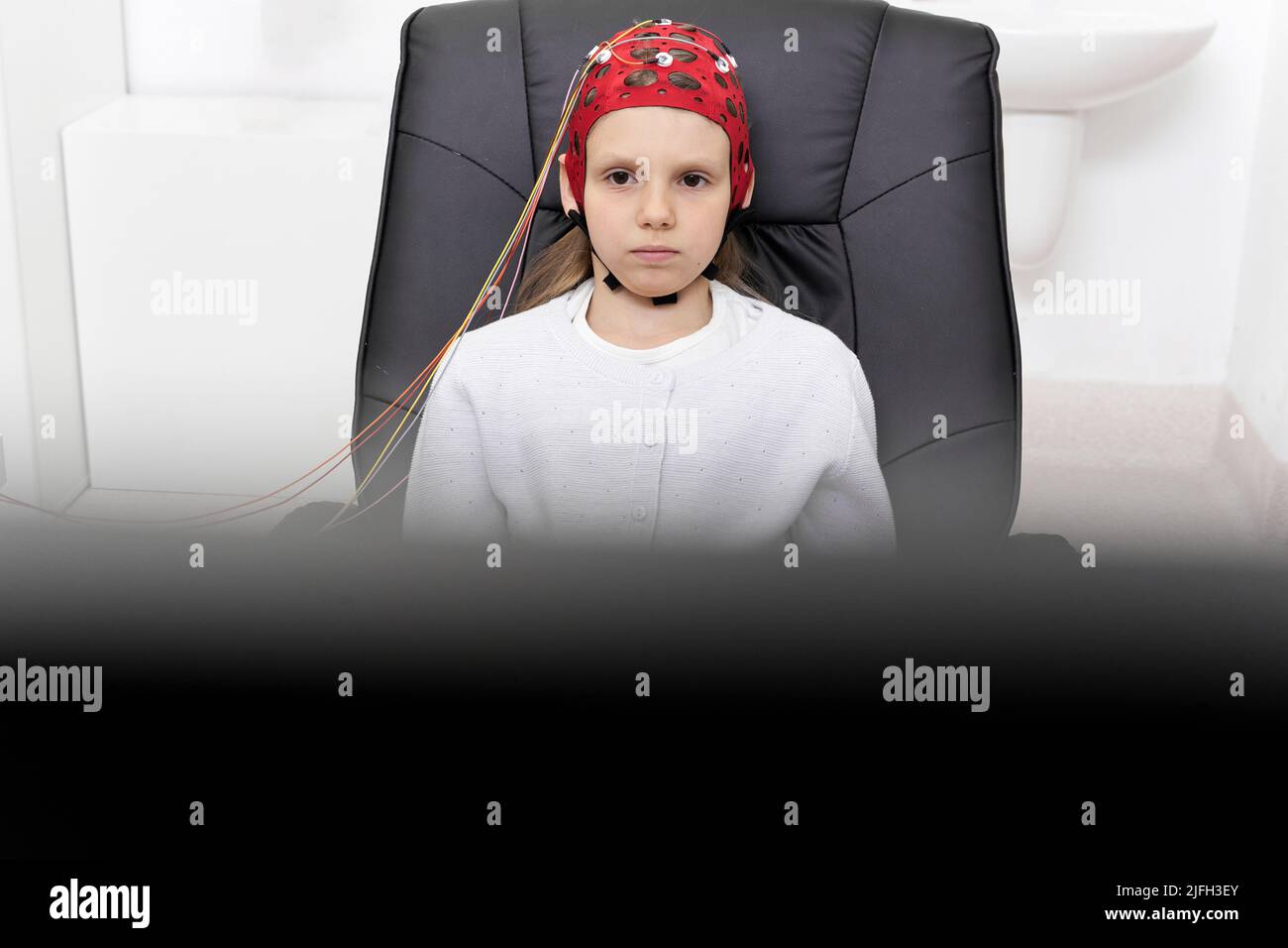Patient looking to a screen during a biofeedback session Stock Photo ...