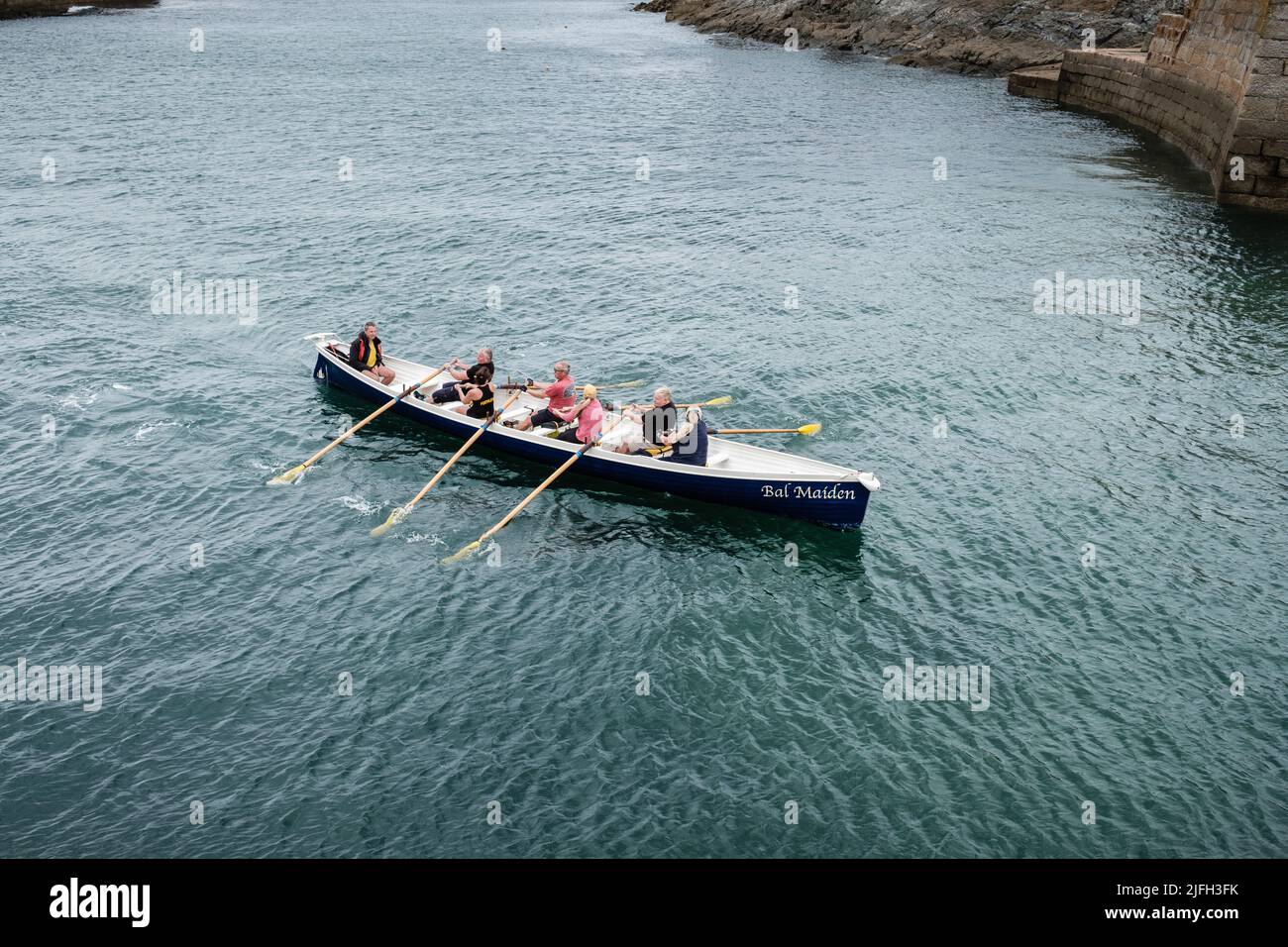 Gig Rowing Training in Porthleven, Cornwall Stock Photo - Alamy