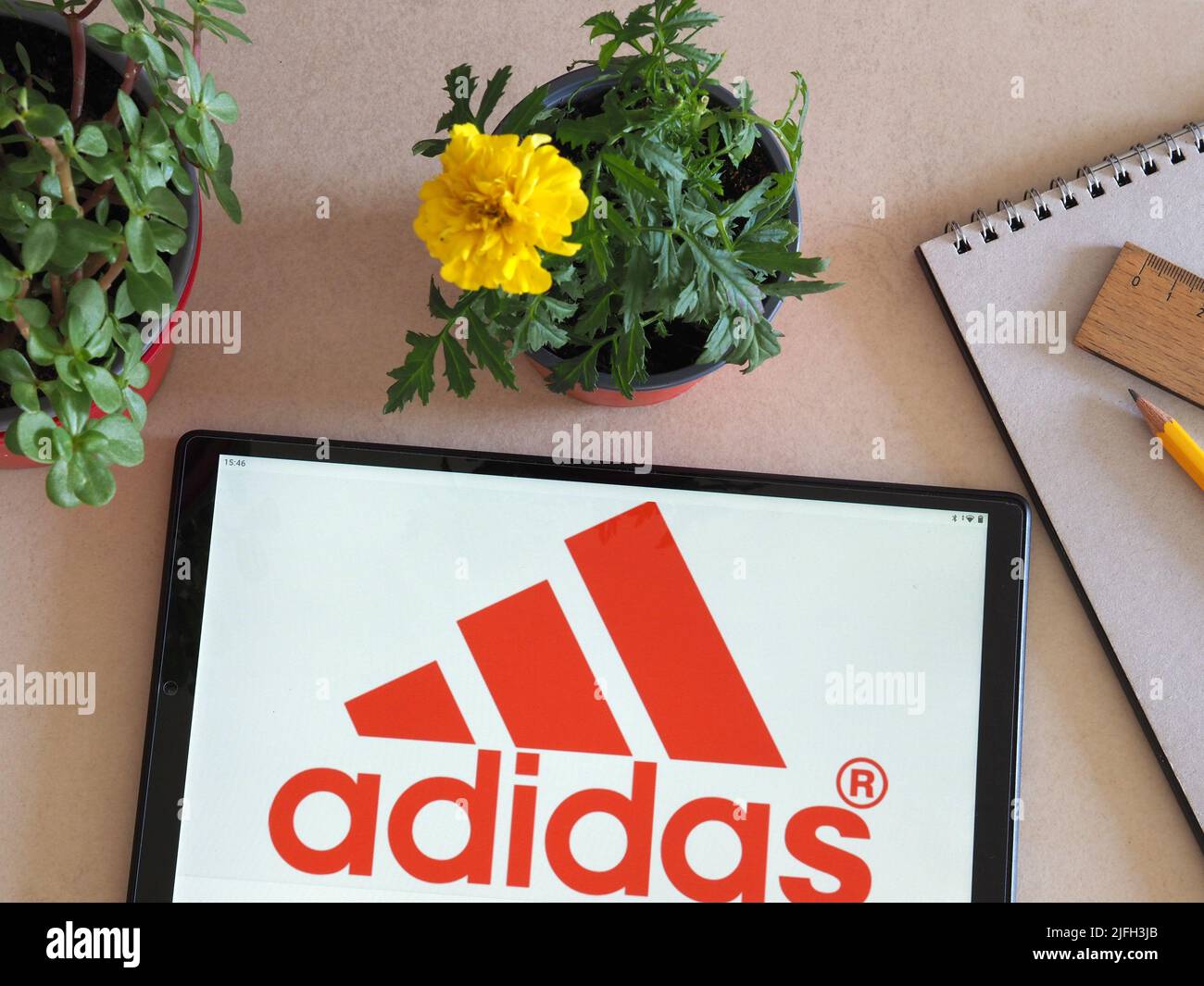 In this photo illustration Adidas AG logo seen displayed on a tablet ...