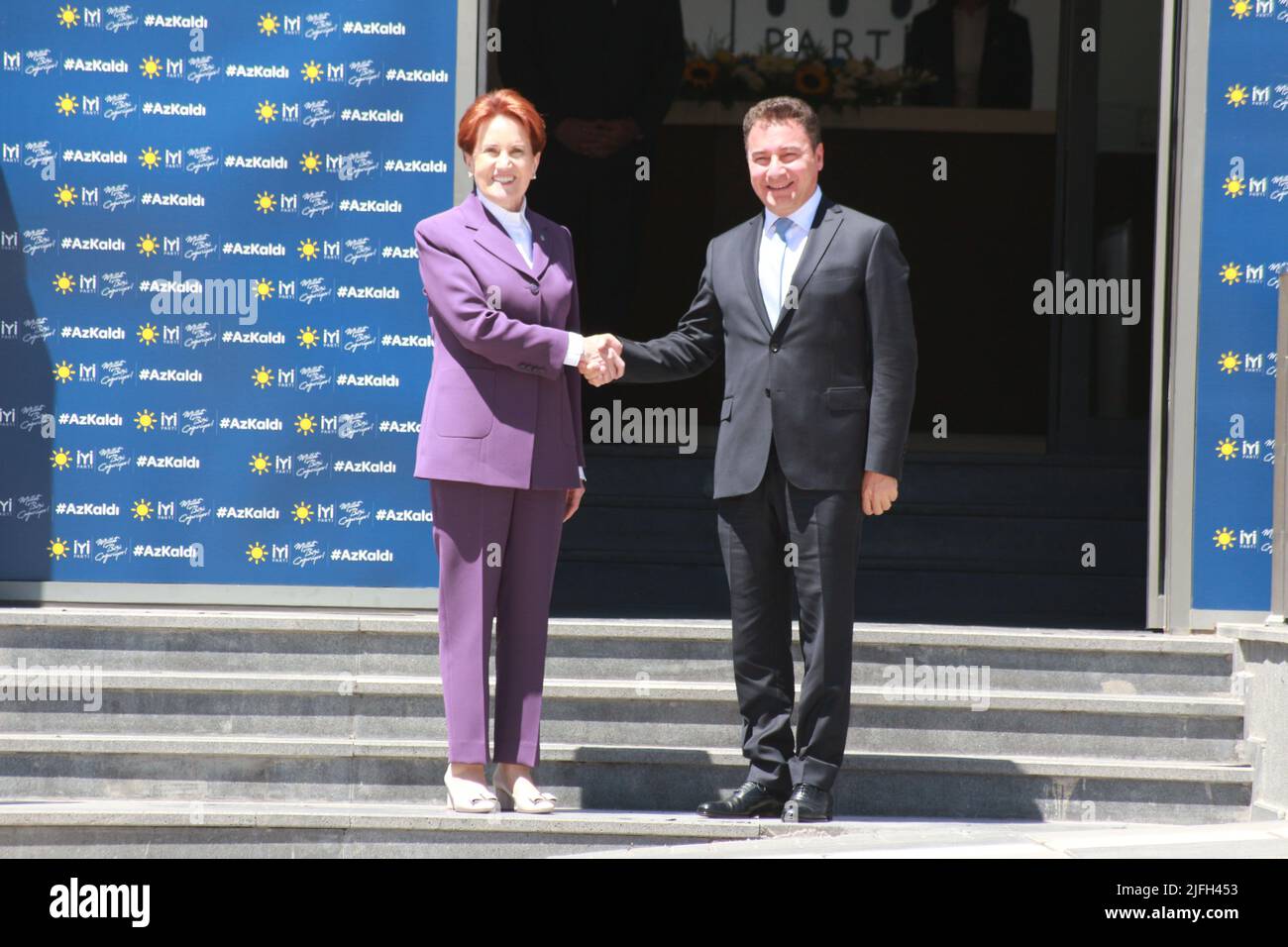 Meral Ak?ener and Ali Babacan shake hands during the meeting. The 6-way ...