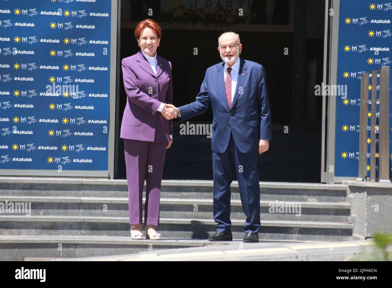 Meral Ak?ener and Temel Karamollao?lu shake hands during the meeting ...