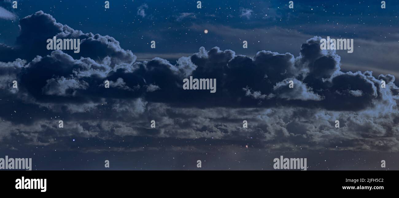 Cloudy night sky with stars. Panorama Stock Photo - Alamy