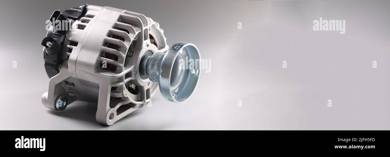 Closeup car generator parts on gray background Stock Photo - Alamy
