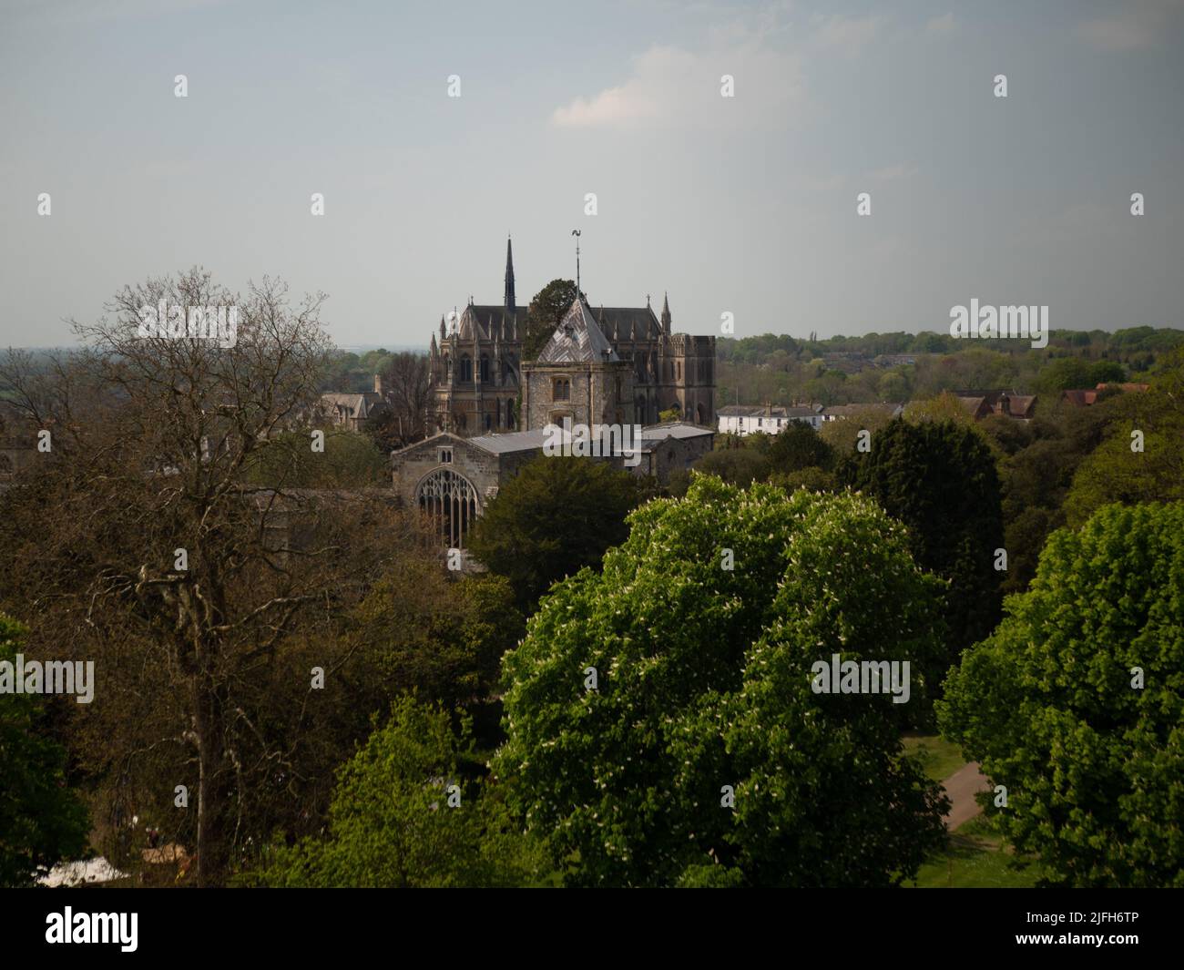An aerial view of the Arundel castle in Brighton through a tree framing ...
