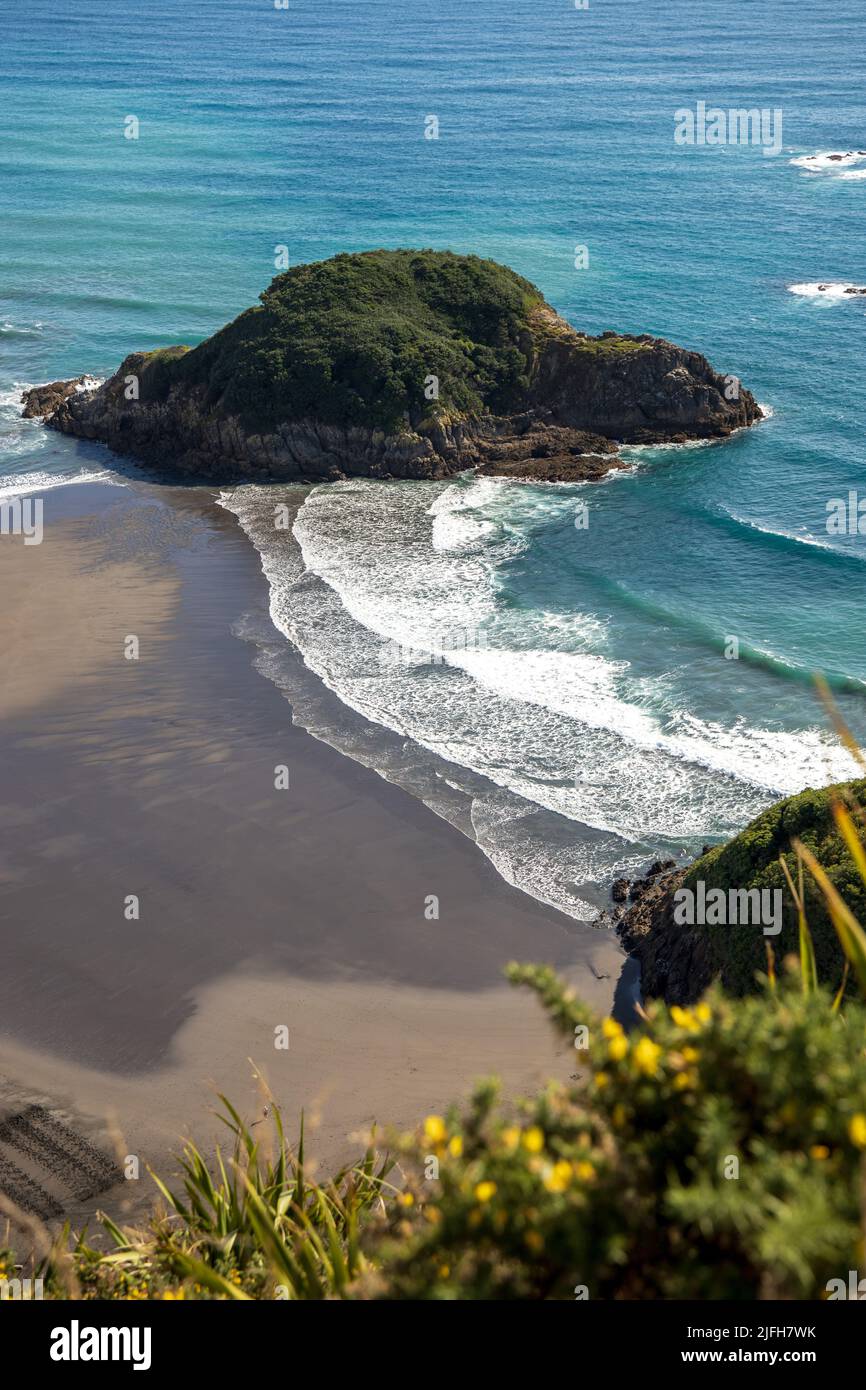 A landscape beach view of Paritutu Rock in New Plymouth, New Zealand ...