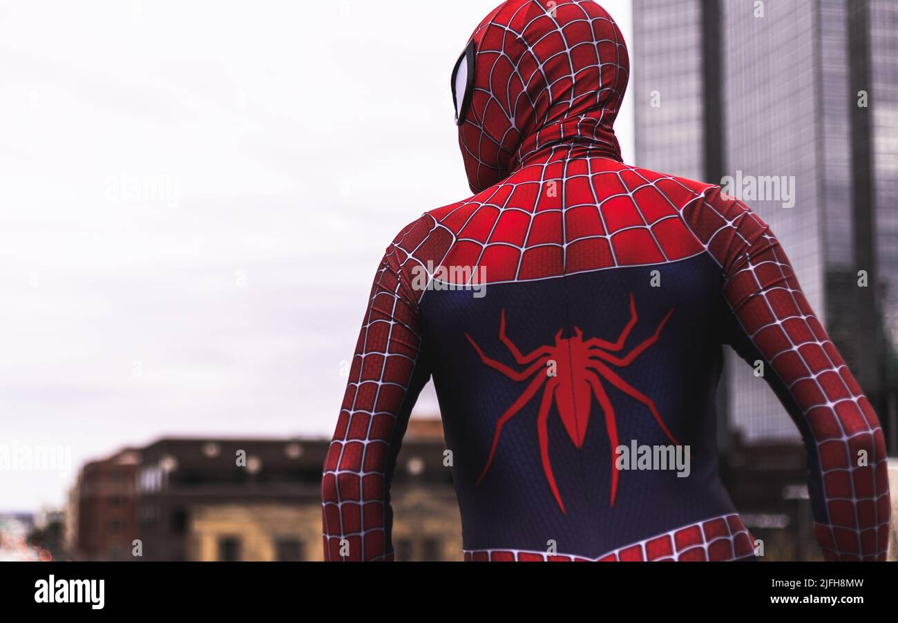 A back view of Spider-Man looking to buildings in Downtown Fort Worth ...
