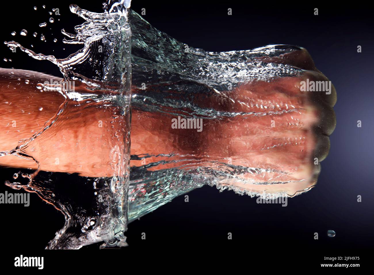 Fist punch through water hi-res stock photography and images - Alamy