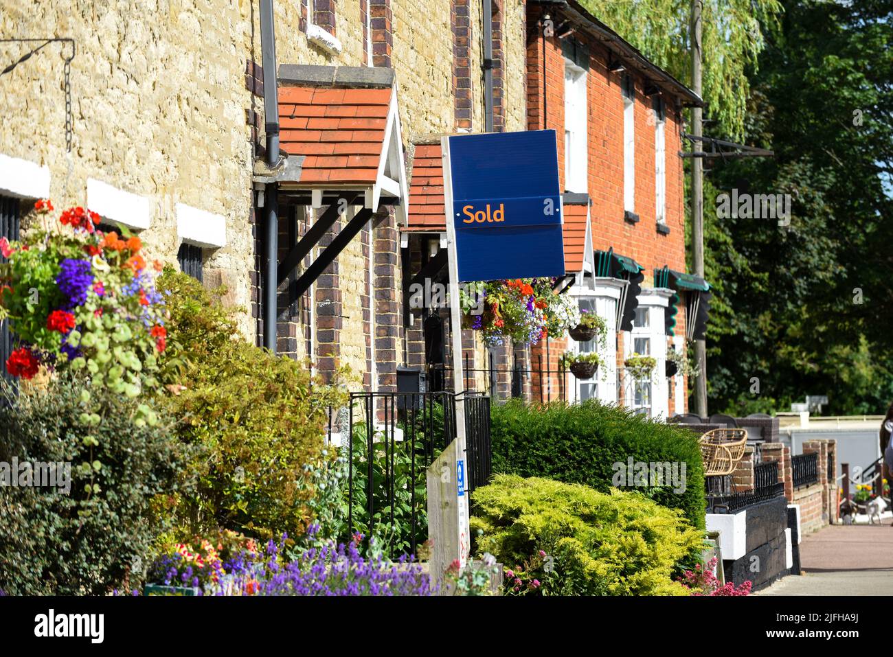 House for sale sign reading sold by estate agent or real estate letting ...