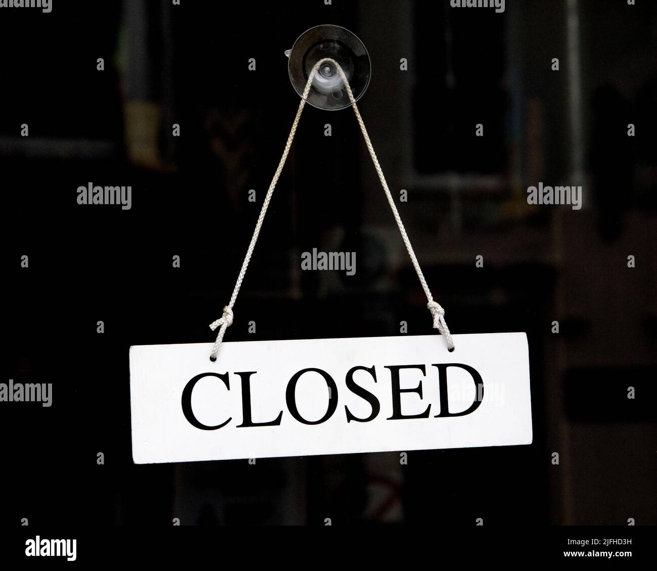 Close-up of a CLOSED sign hanging in a window Stock Photo - Alamy
