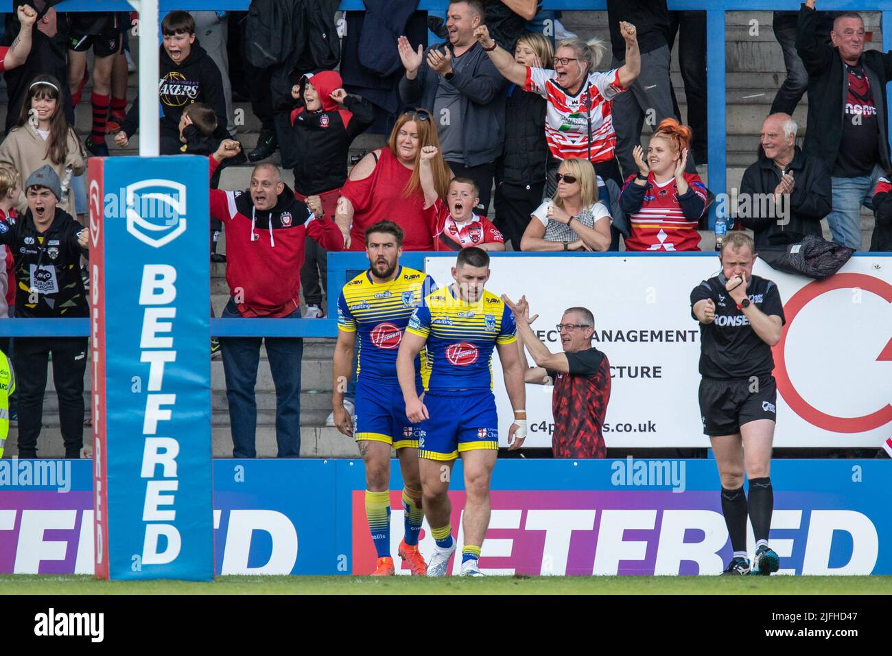 The Salford Red Devils supporters celebrate as Danny Walker #16 of ...