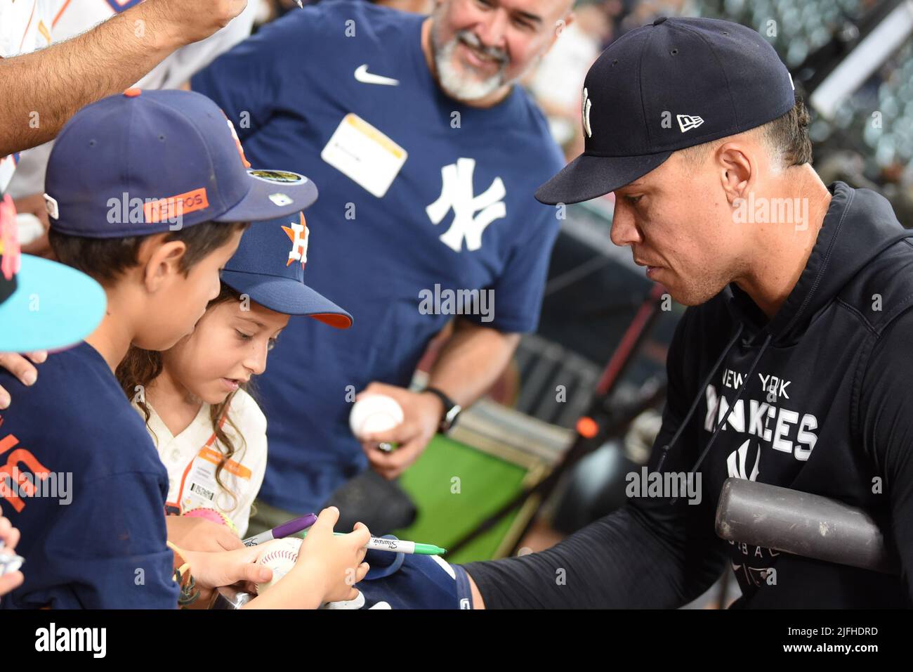 New York Yankees center fielder Aaron Judge (99) signs autographs ...