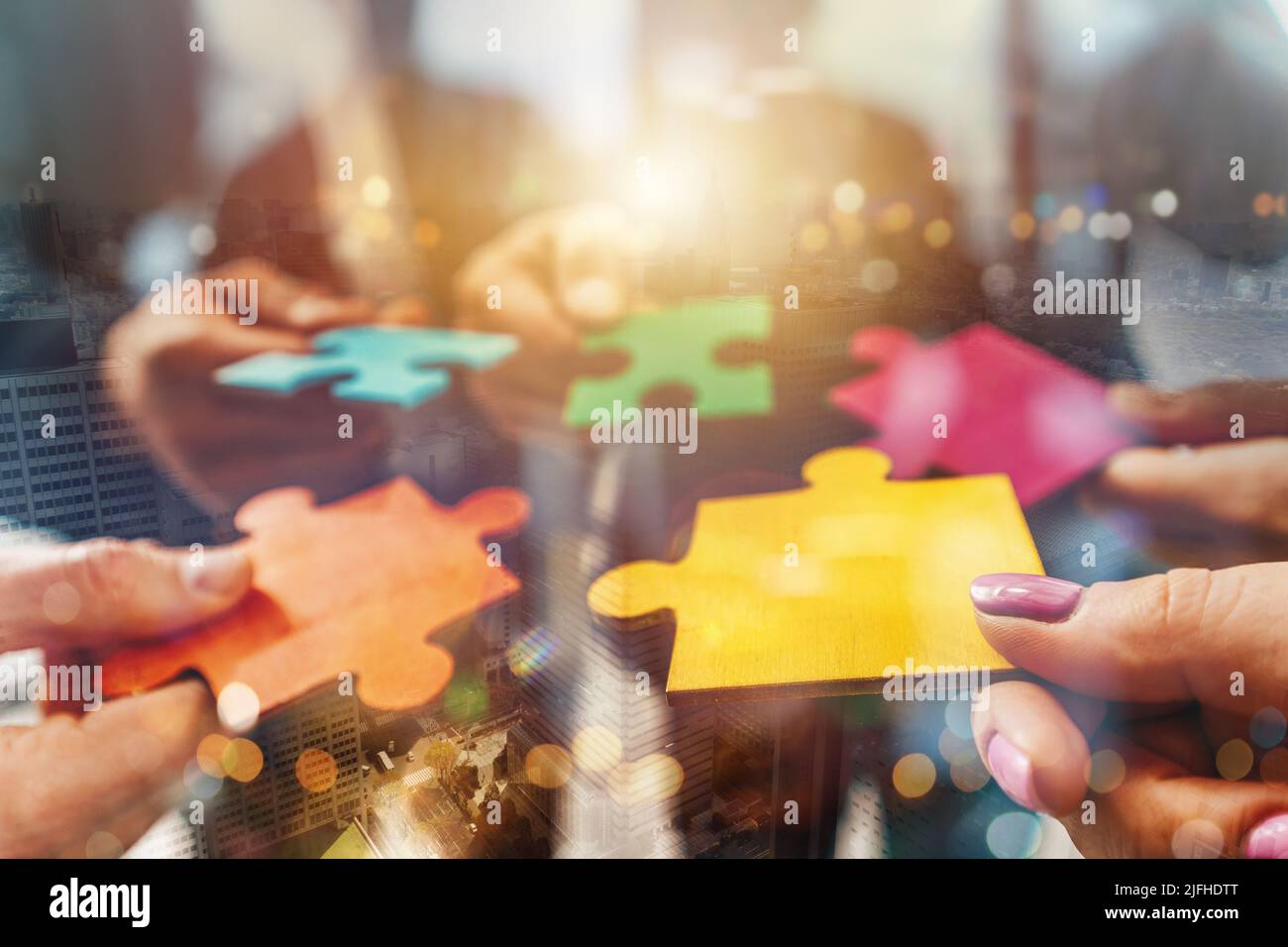 Teamwork of partners connect puzzle pieces as integration and startup ...