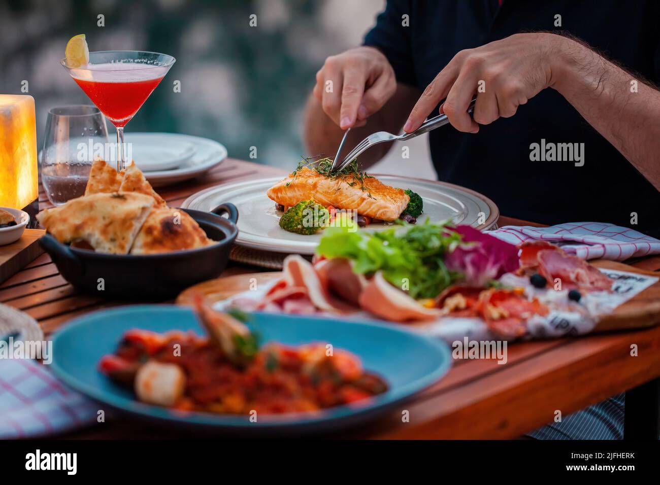 Man on luxury dinner served on table with fresh seafood in luxury ...