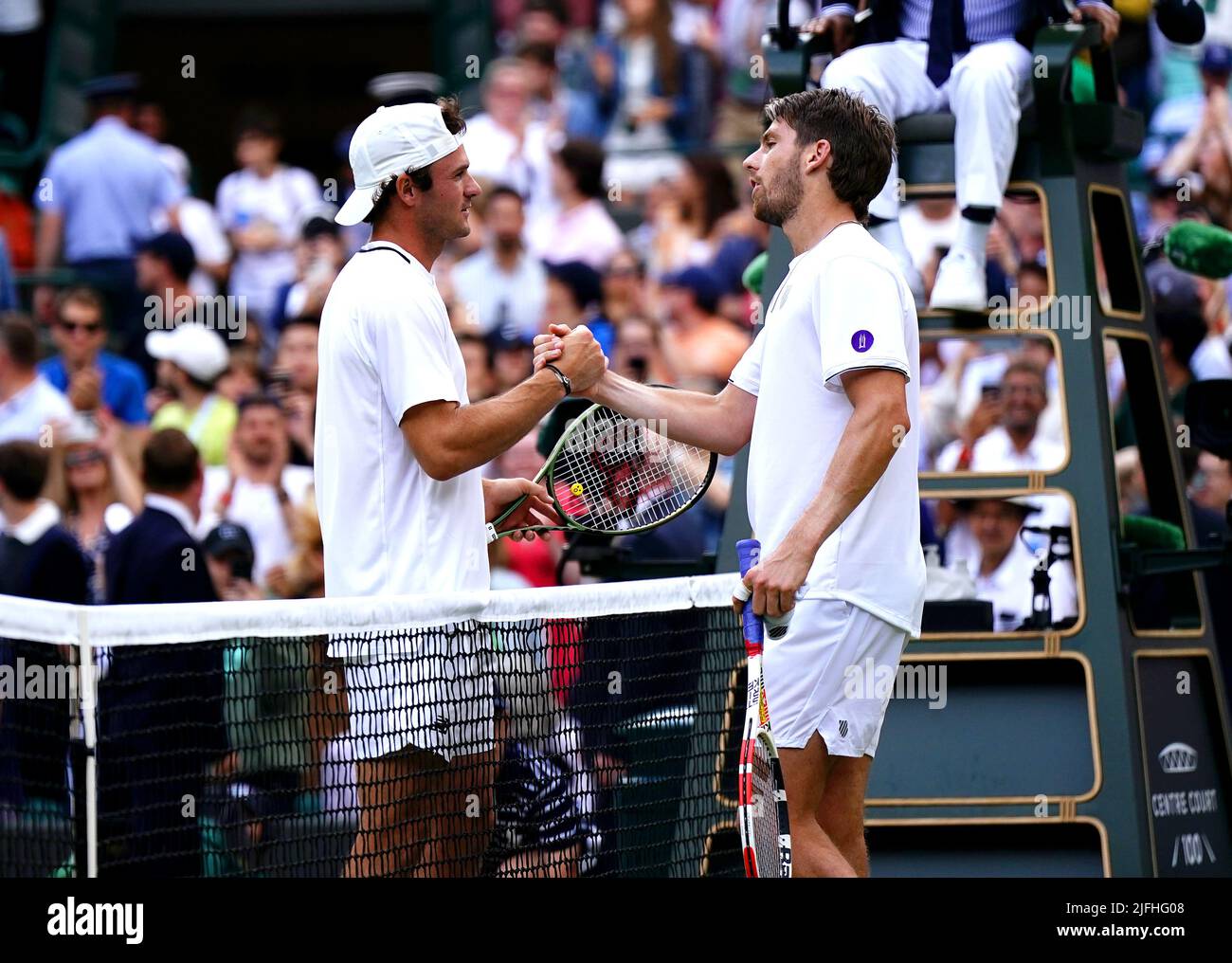 Cameron Norrie (right) shakes hands with Tommy Paul after winning their ...