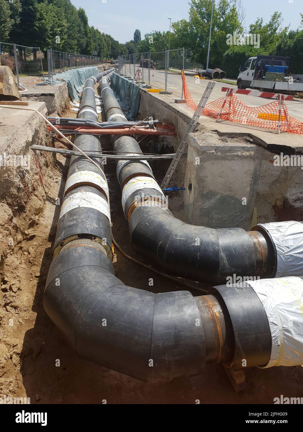 Reconstruction site of district heating system pipeline and replacement of old pipes with new ...