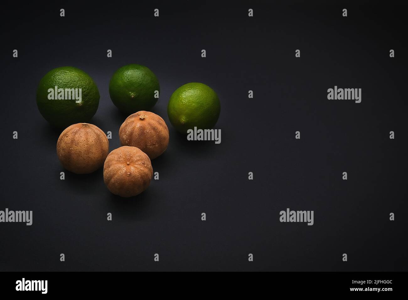 Fresh dark green and sun dried organic fruits of Loomi or Black Lime ...