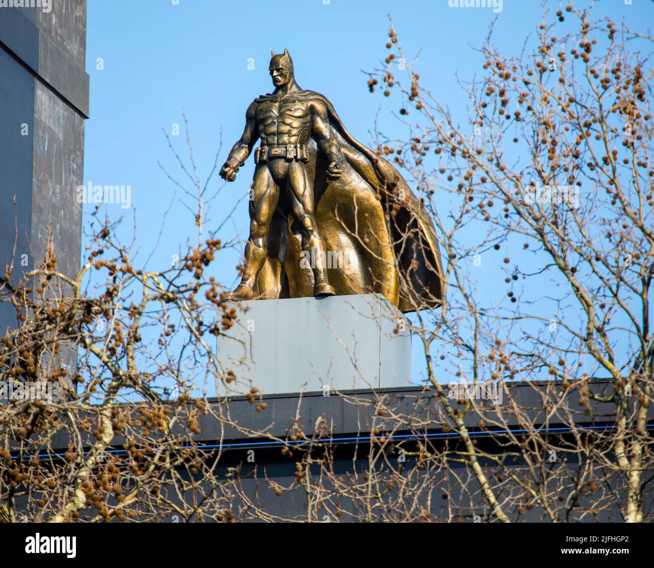 London, UK - March 8th 2022: Statue of Batman on the roof of the Odeon ...