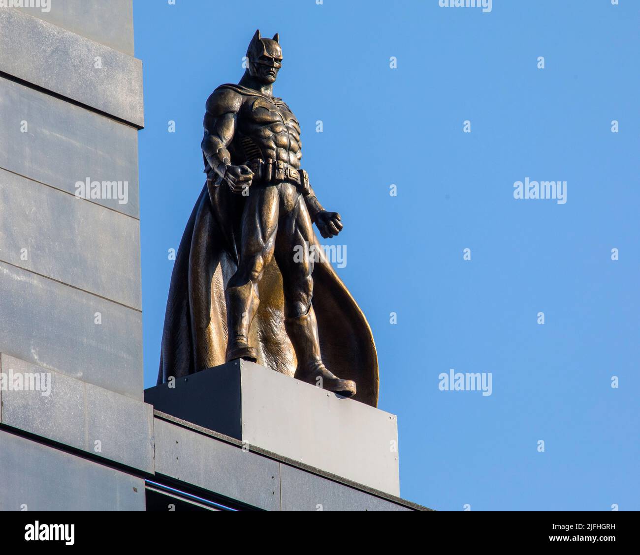 London, UK - March 8th 2022: Statue of Batman on the roof of the Odeon ...