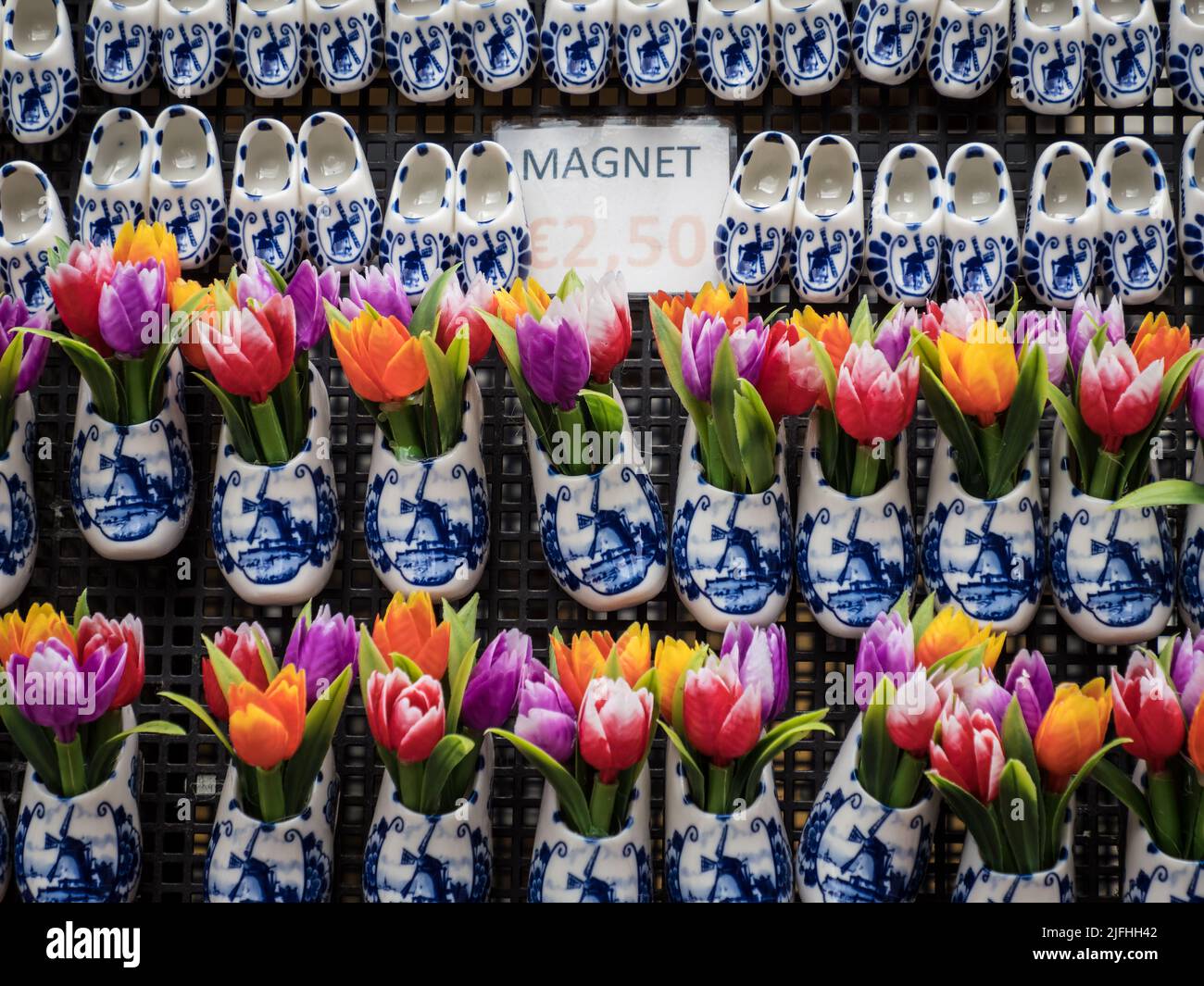 Display of ceramic clogs and wooden tulips for sale in a tourist store ...