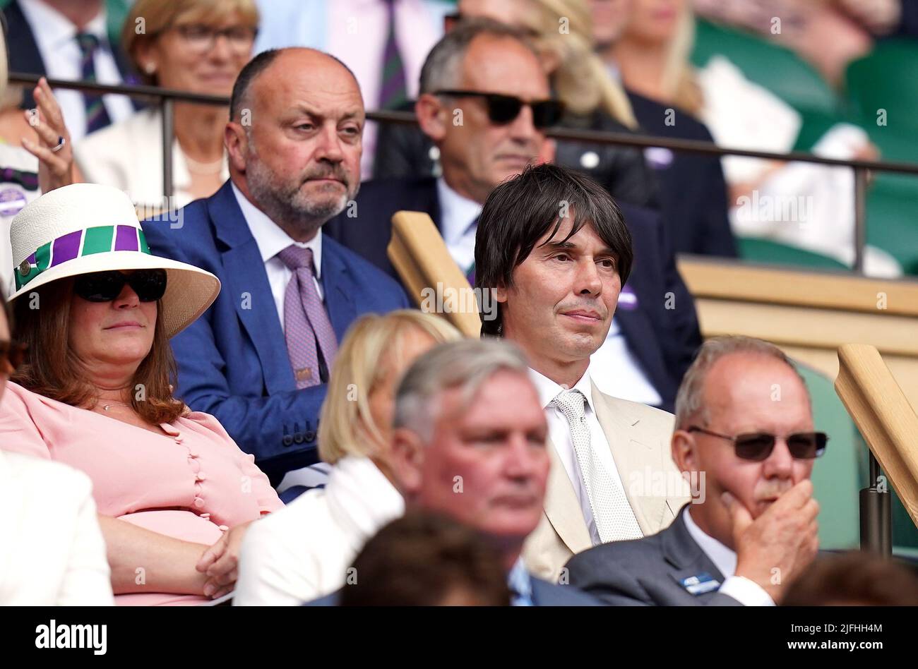 Professor Brian Cox (centre right) in the royal box on centre court ...