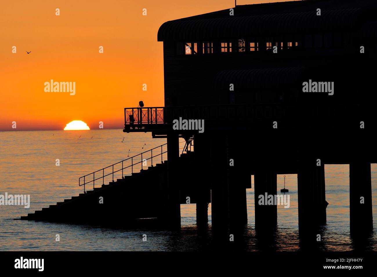 Midsummer sunrise, beside Cromer pier, Norfolk, England, UK Stock Photo ...