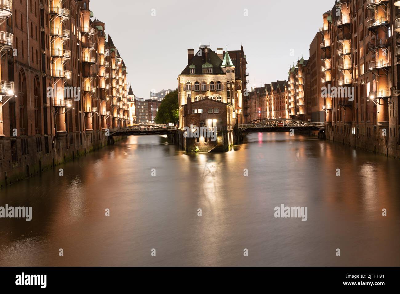 A night view of the illuminated Wasserschloss in Hamburg, Germany Stock ...