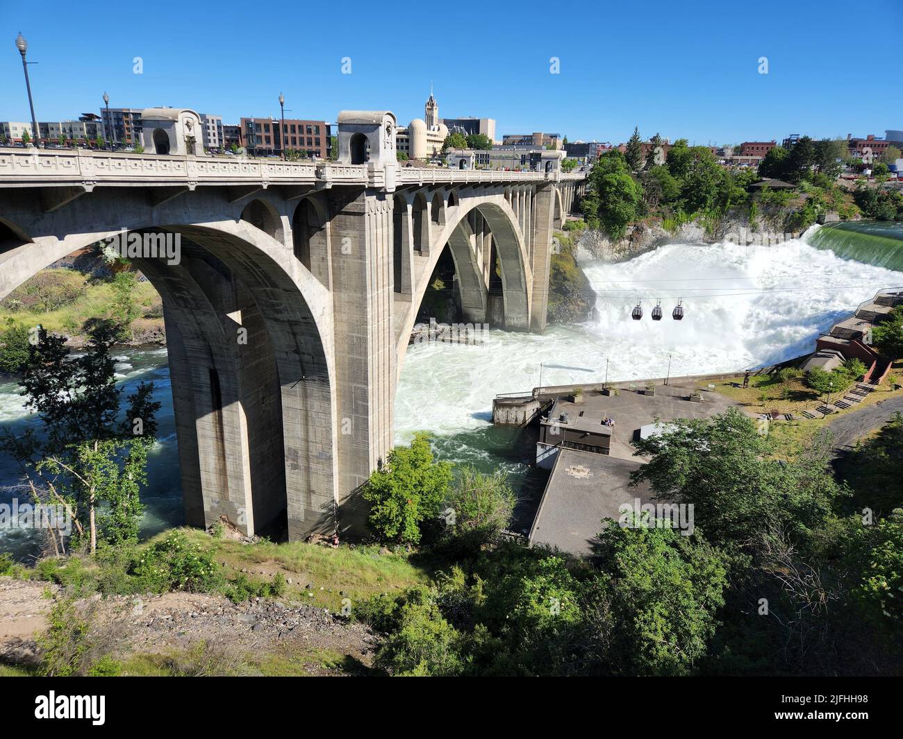 Torrential flow over Lower Spokane Falls under Monroe Street Bridge in ...