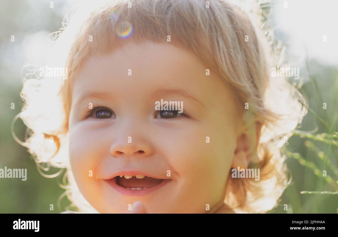 Portrait of a happy laughing child. Close up positive kids cropped face ...