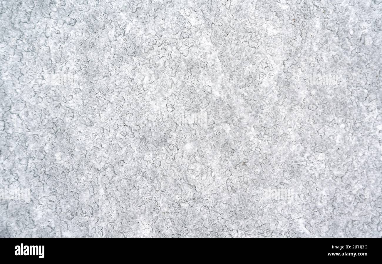 Snow creating texture on the glass. Structure of snow flakes and ice ...