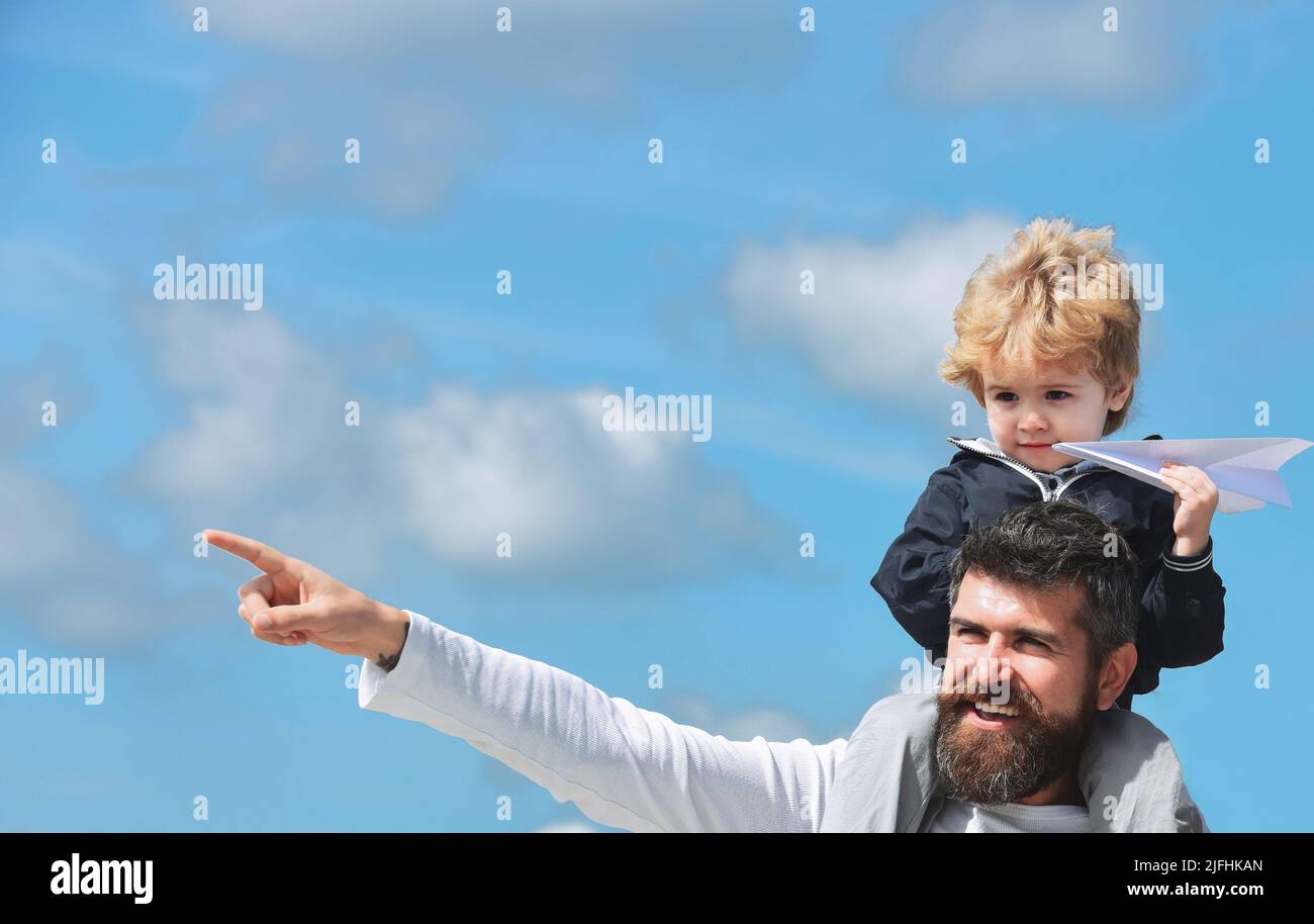 Fathers day. Father giving son ride on back in park. Funny time Stock ...