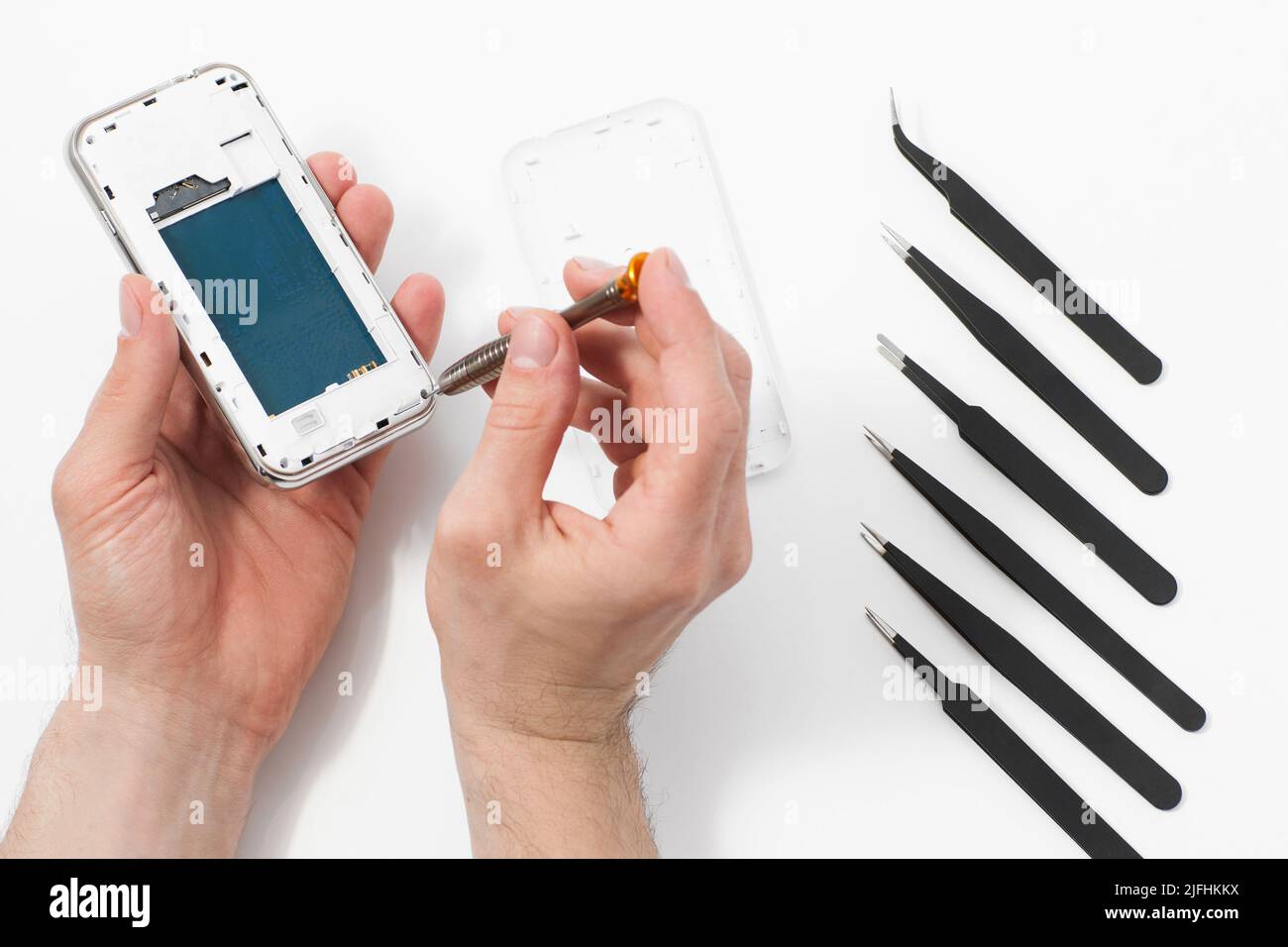 Smartphone disassembling with special tools Stock Photo - Alamy