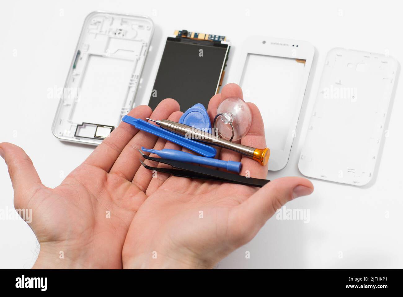 Disassembly tools and disassembled phone Stock Photo - Alamy