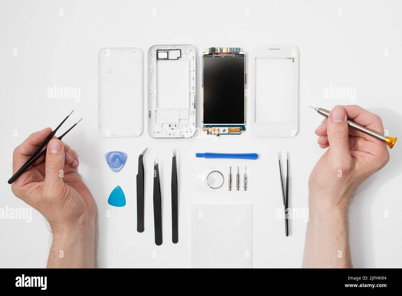 Repairman workplace with phone and tools Stock Photo - Alamy