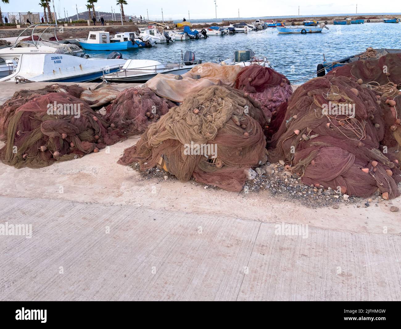 Fishing nets on the floor in a small harbor Stock Photo - Alamy