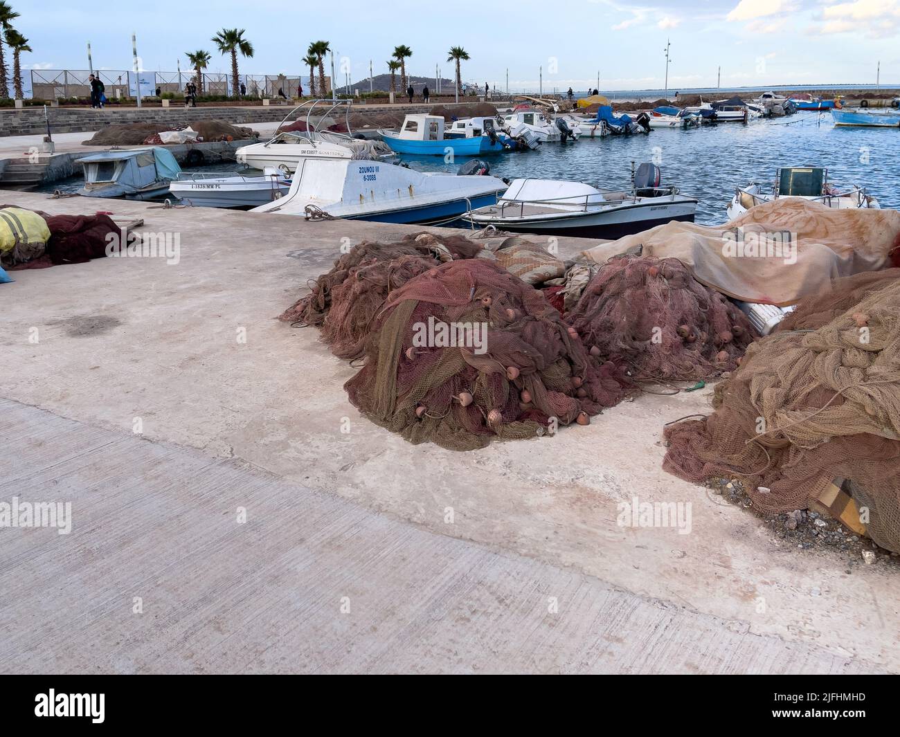 Fishing nets on the floor in a small harbor Stock Photo - Alamy