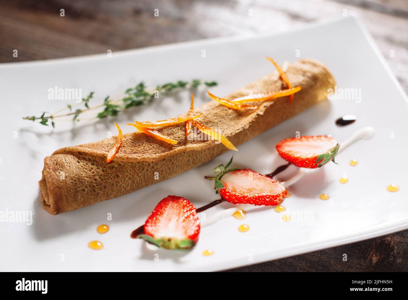 Crepe with strawberry dessert front view Stock Photo - Alamy