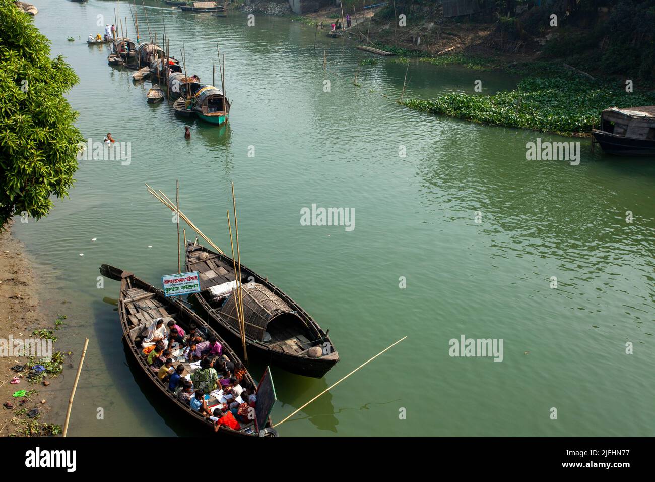 A floating school on a small boat for gypsy children on a canal near ...
