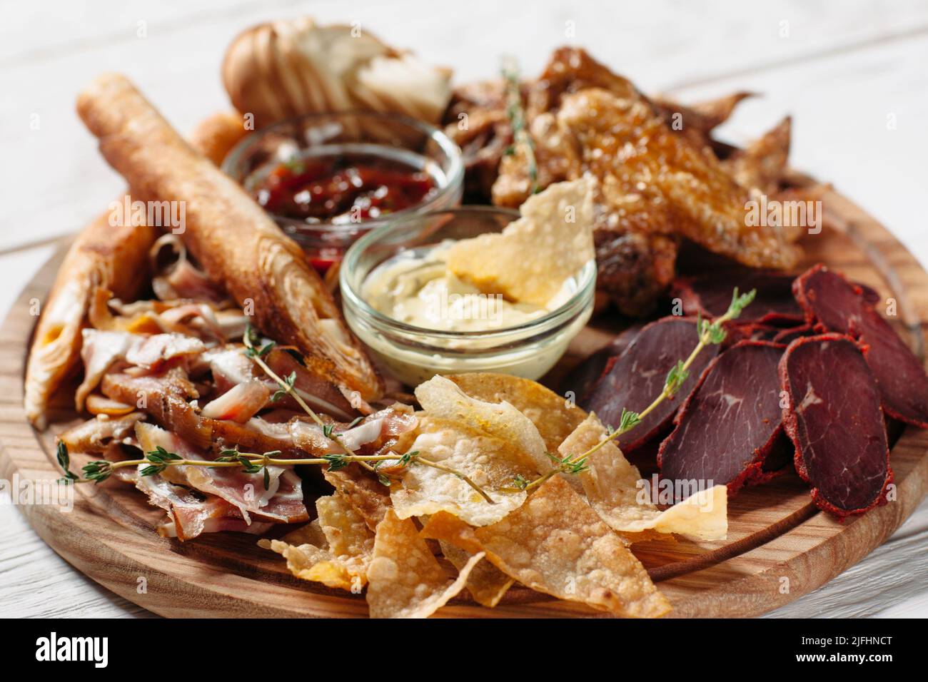 Beer snacks plate. Meat and chips Stock Photo - Alamy