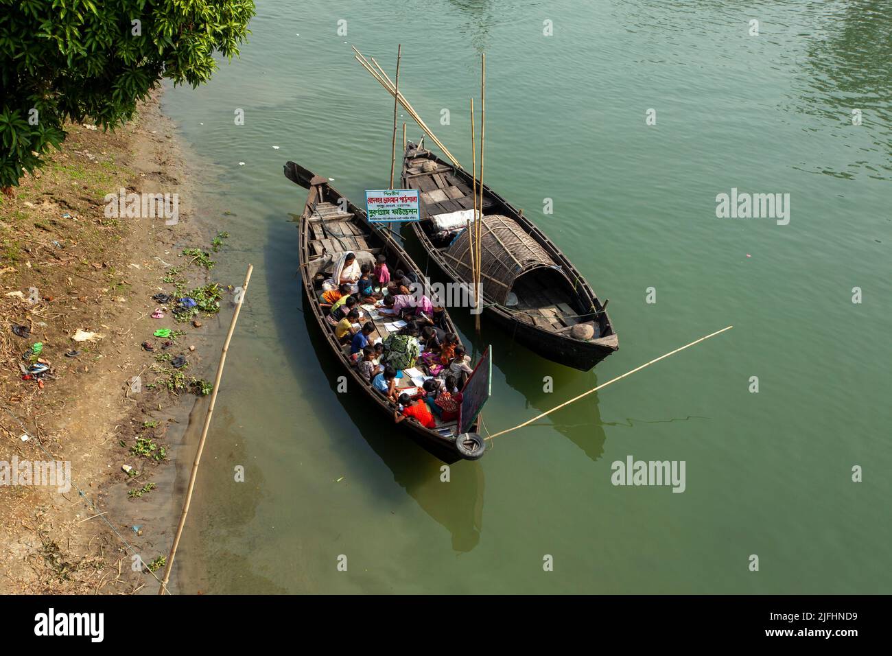 A floating school on a small boat for gypsy children on a canal near ...