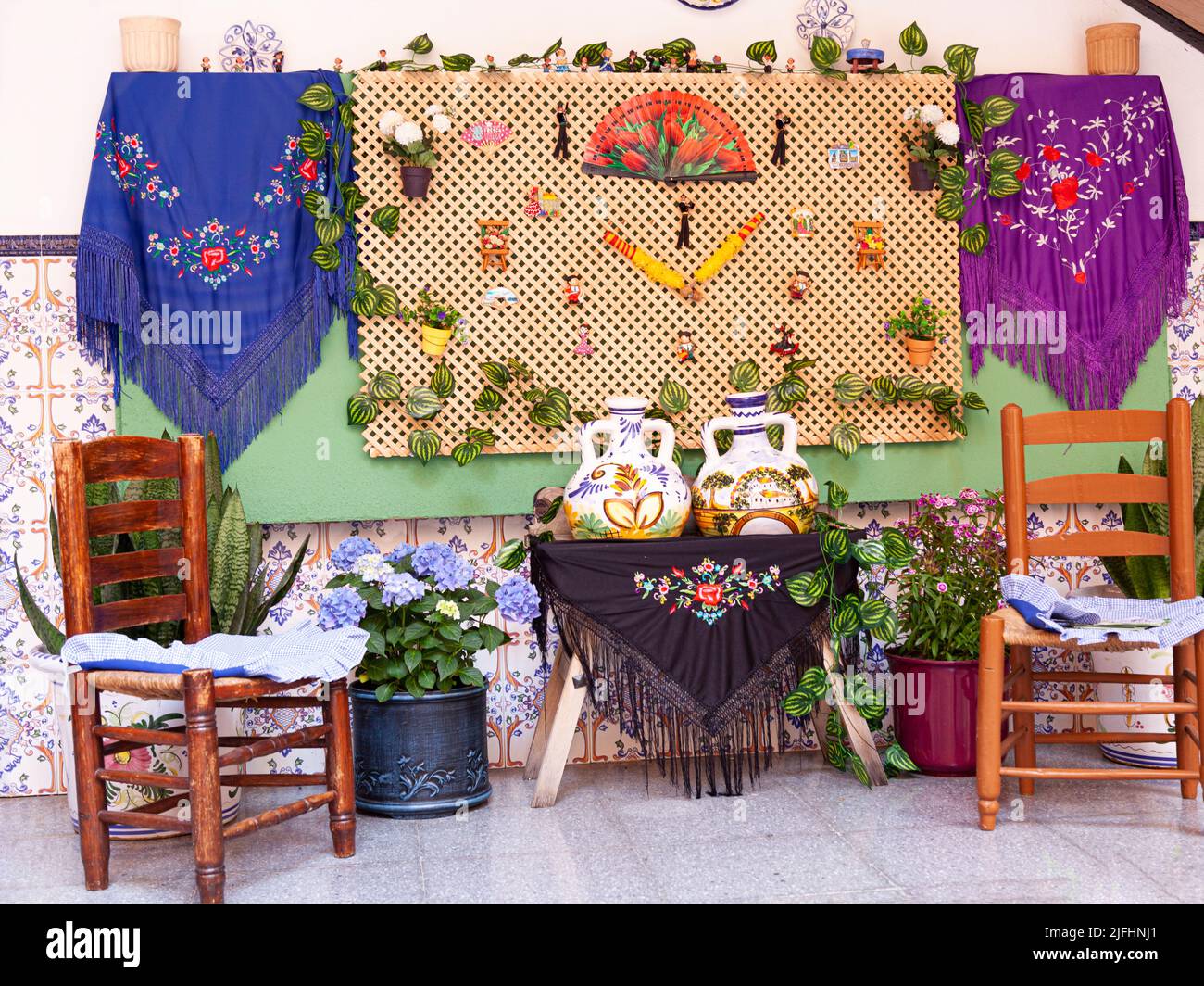 typical Andalusian patio with Gea chairs, table with mantles from ...