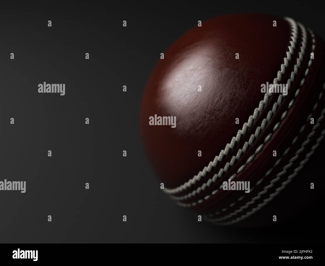 A regular red cricket ball with white stitching on an isolated ...