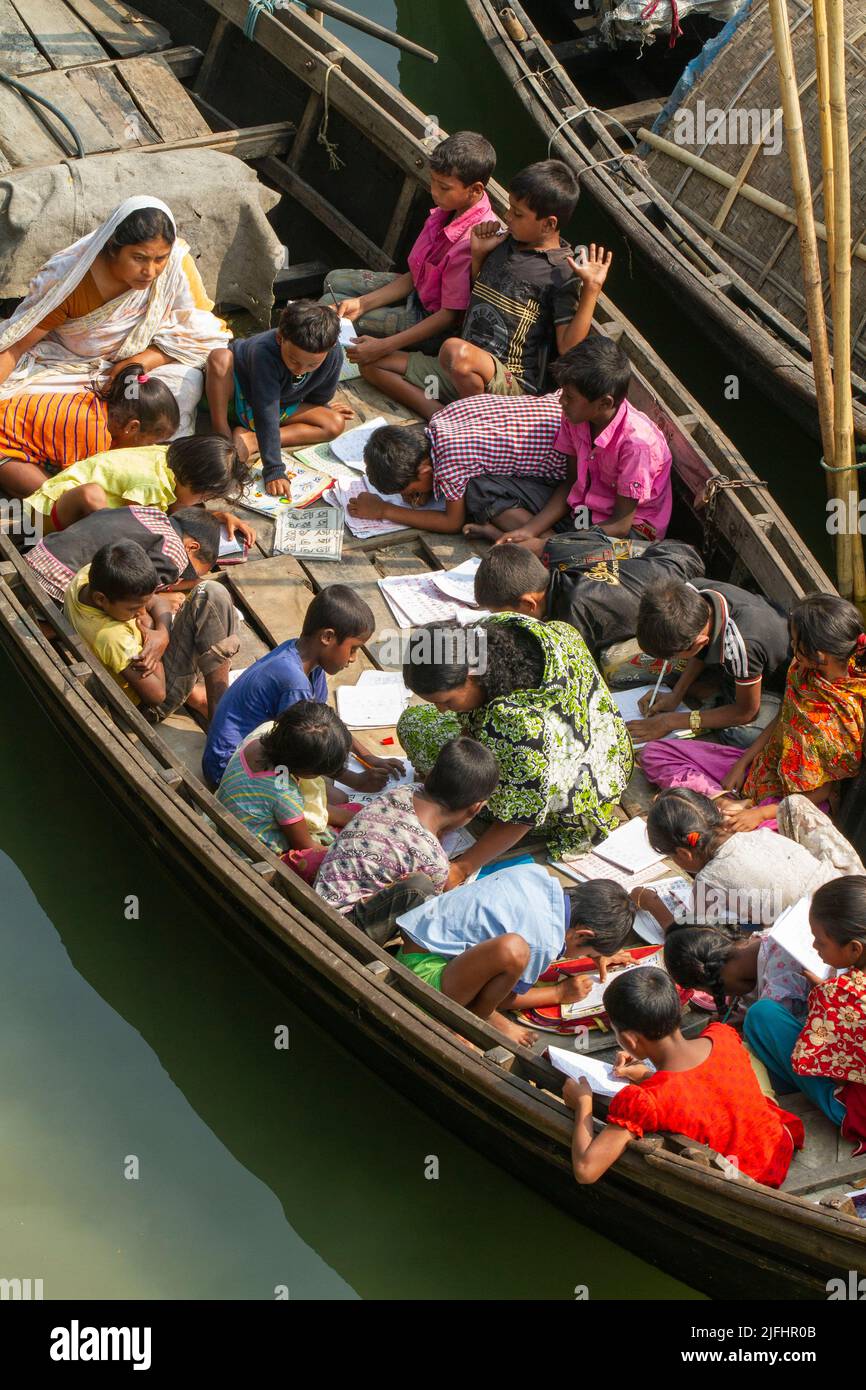 A floating school on a small boat for gypsy children on a canal near ...