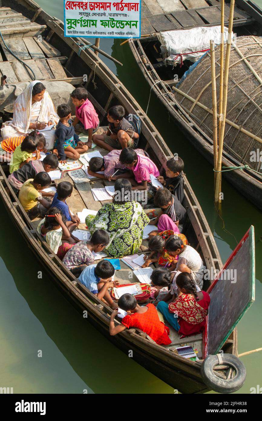 A floating school on a small boat for gypsy children on a canal near ...