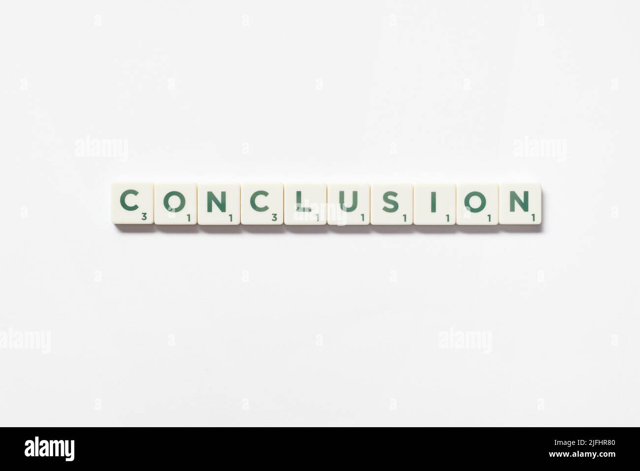 Conclusion formed of scrabble blocks on white background Stock Photo ...