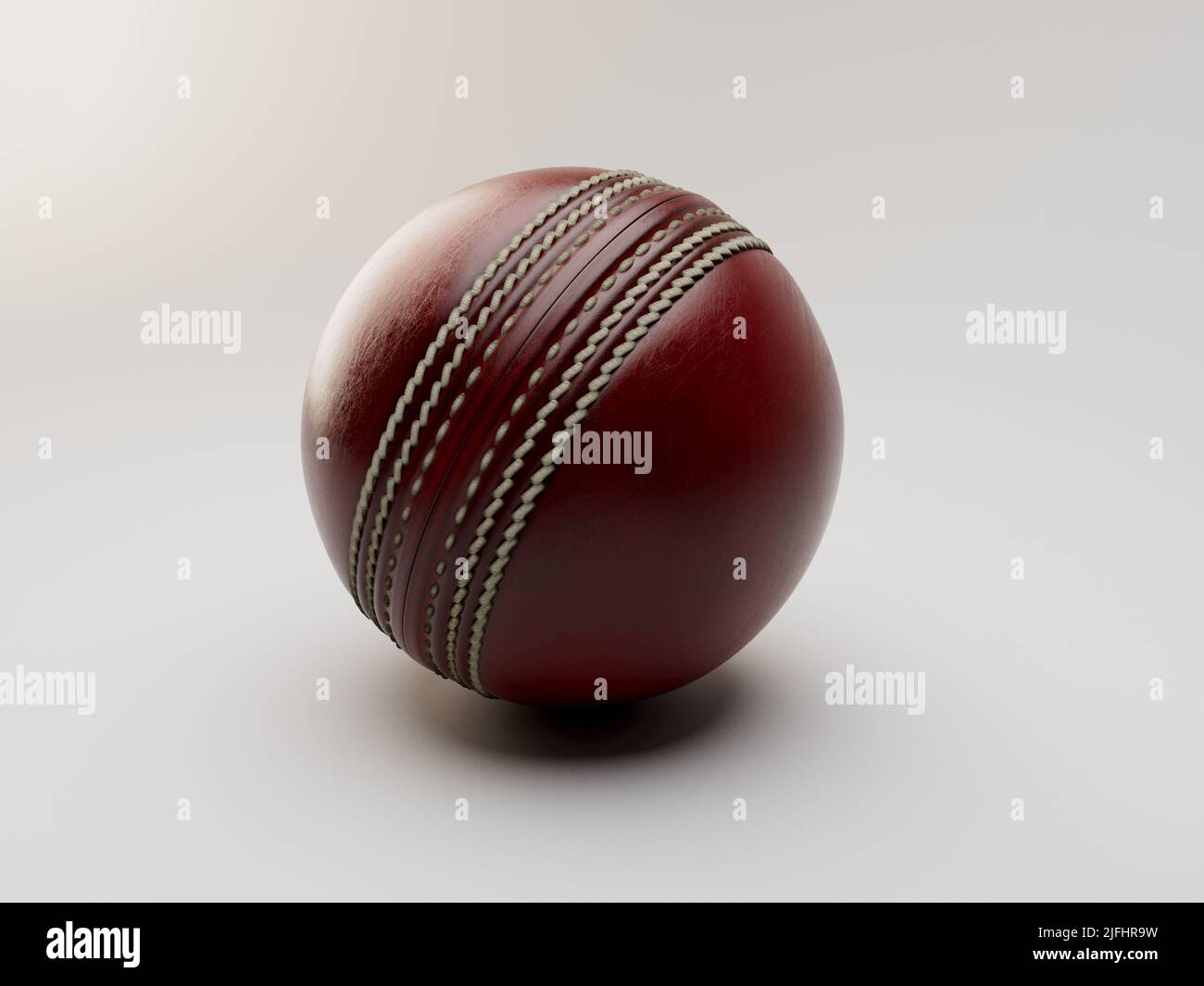 A regular red cricket ball with white stitching on an isolated ...