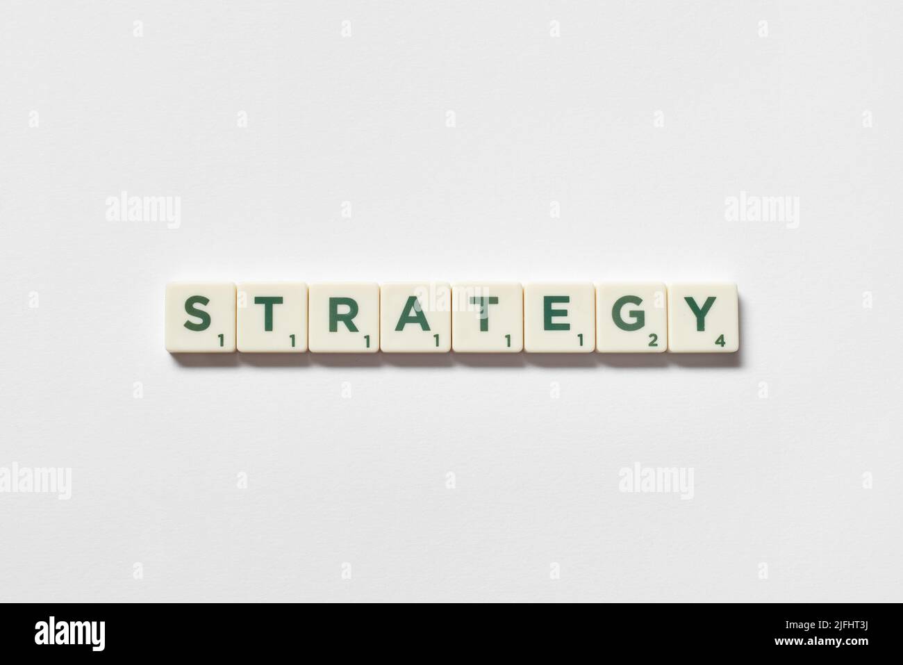 Strategy formed of scrabble blocks on white background Stock Photo - Alamy