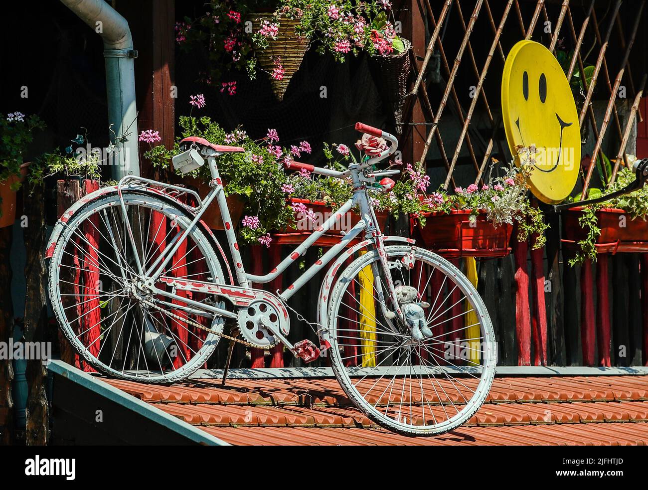 Decorated bicycle seen on the roof of a house in Zagreb, Croatia, on ...